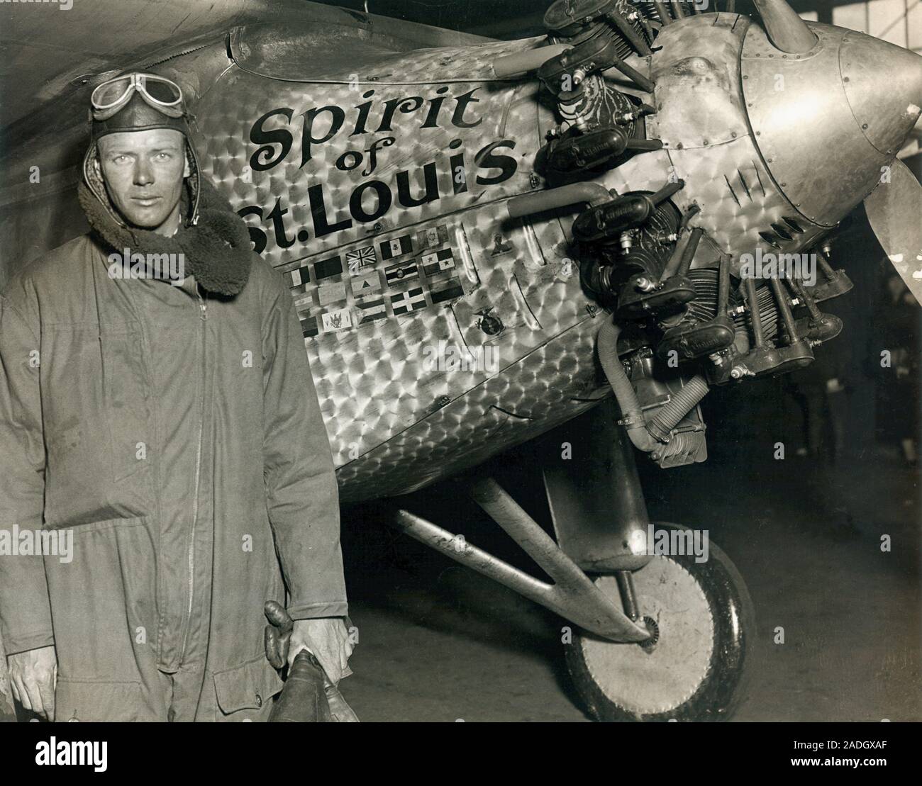 Lindbergh with his airplane. US aviation pioneer Charles Lindbergh ...
