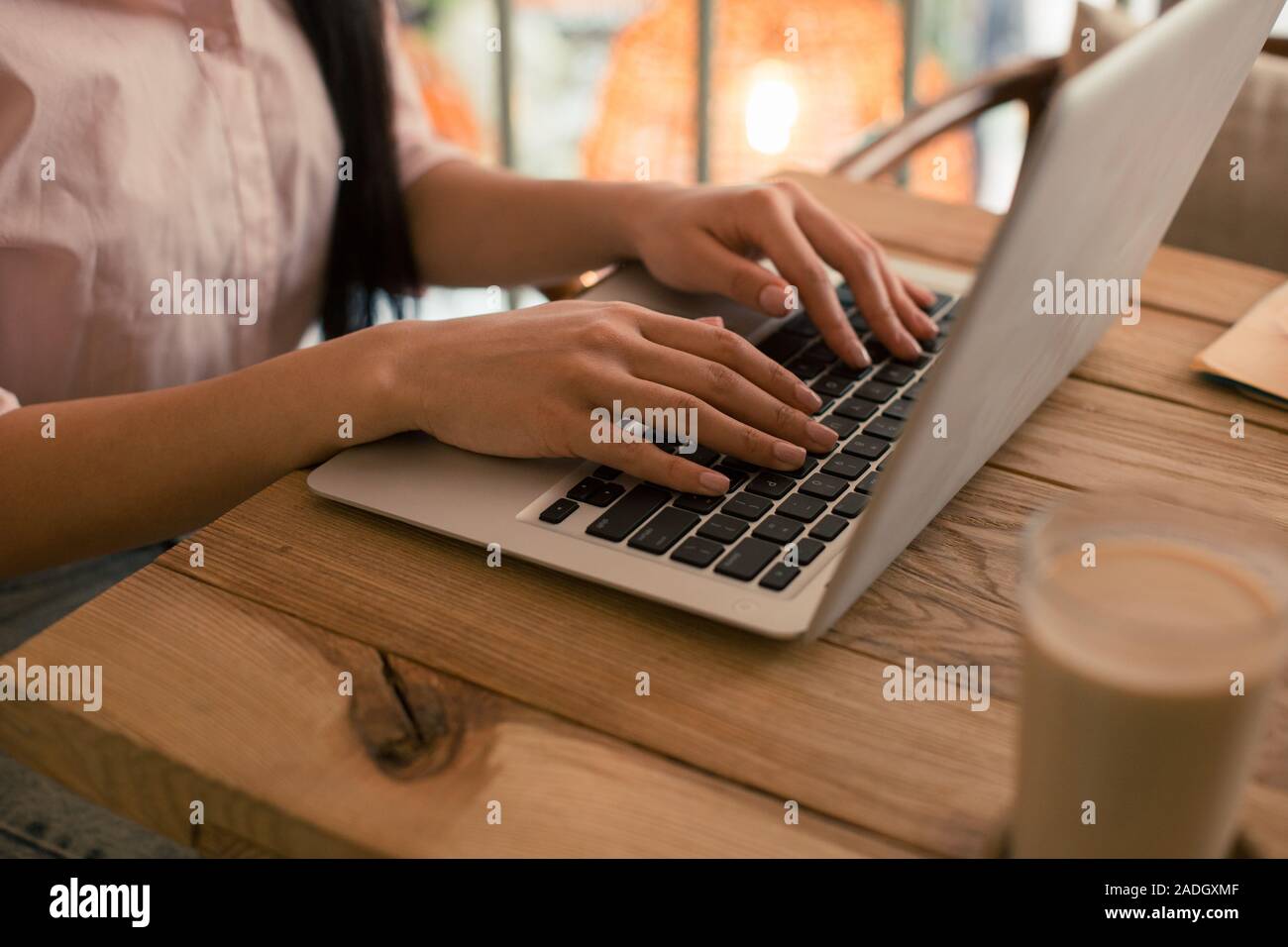 Hands of woman on the keyboard of her laptop Stock Photo - Alamy