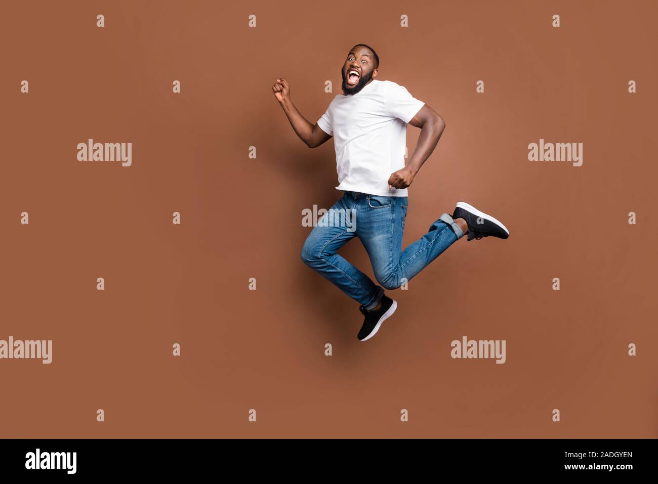 Full length body size photo of urgent jumping running shouting guy ...