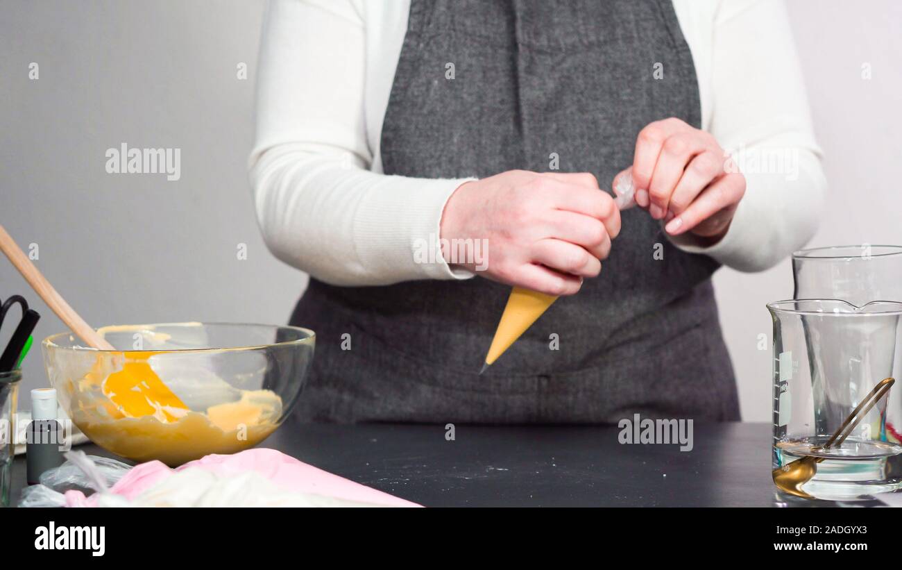 Step by step. Pouring royal icing into the piping bag to decorate sugar ...