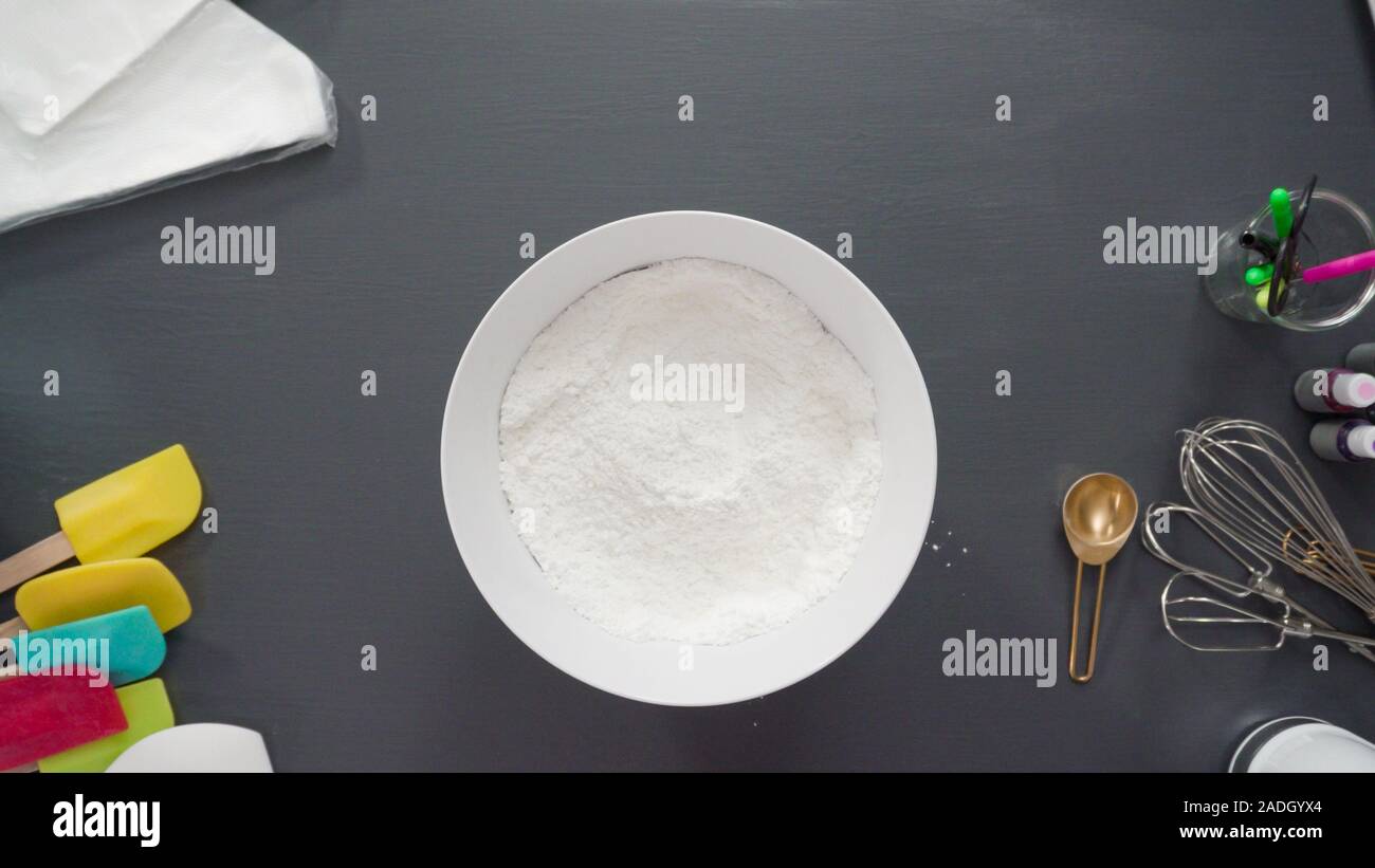 Step by step. Flat lay. Preparing simple royal icing to decorate sugar ...