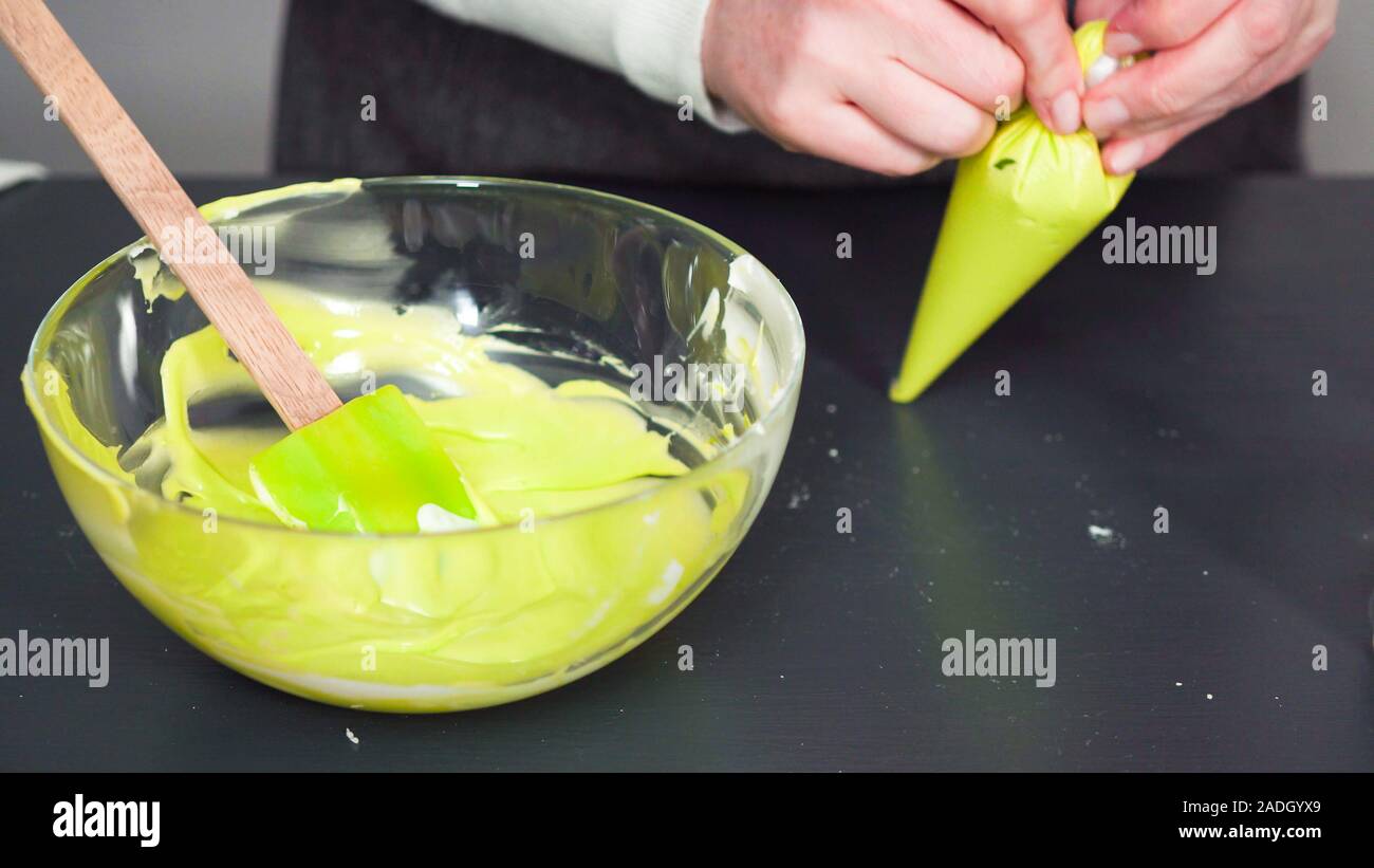 Step by step. Pouring royal icing into the piping bag to decorate sugar ...