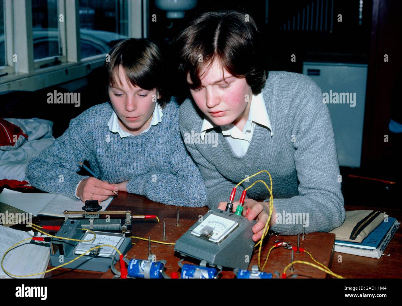 Secondary education, showing pupils in physics class studying Ohm's law ...