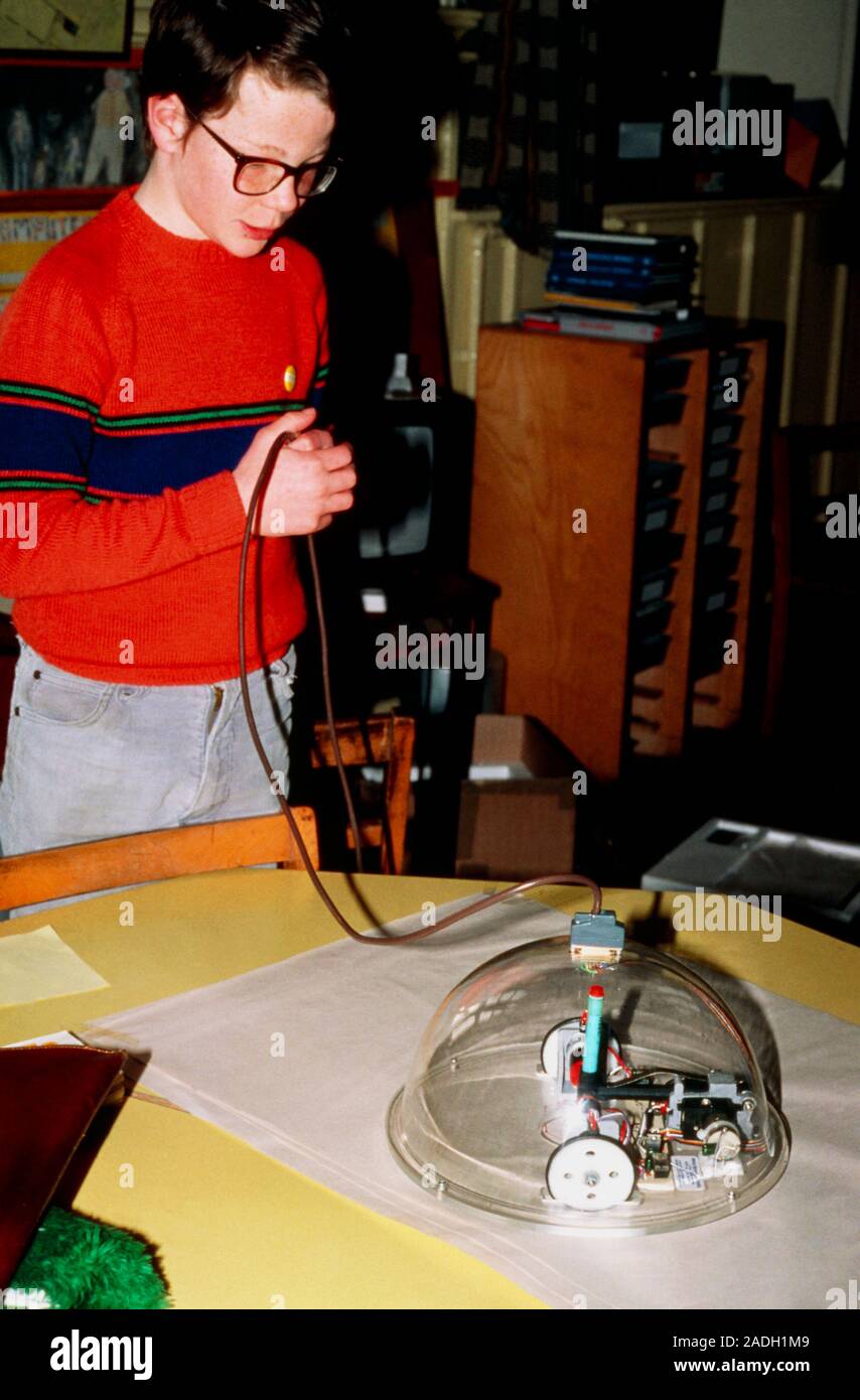 Primary school pupil manipulating a Turtle" robot, an educational ...