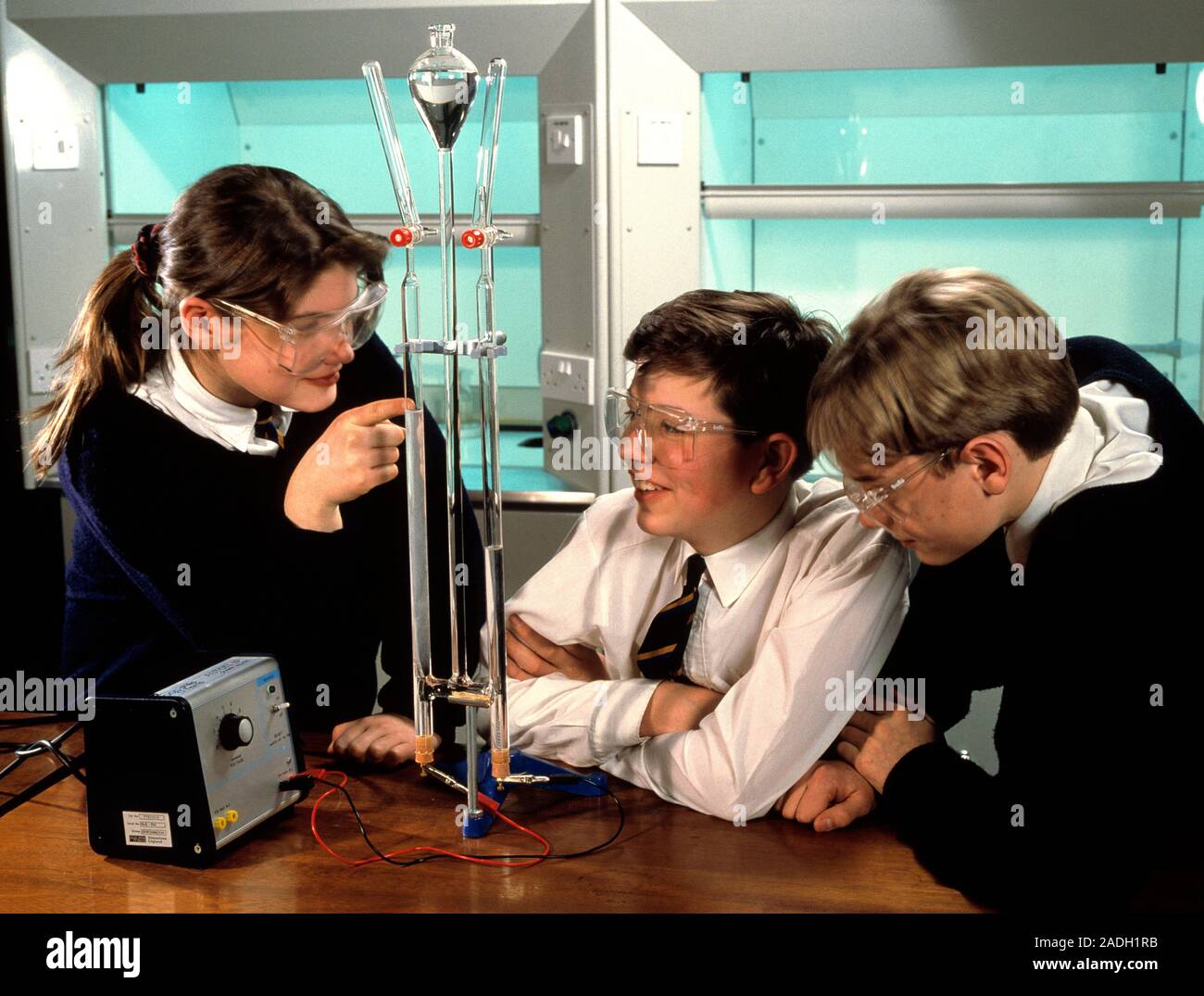 Electrolysis of water. Students observing the electrolysis of water ...