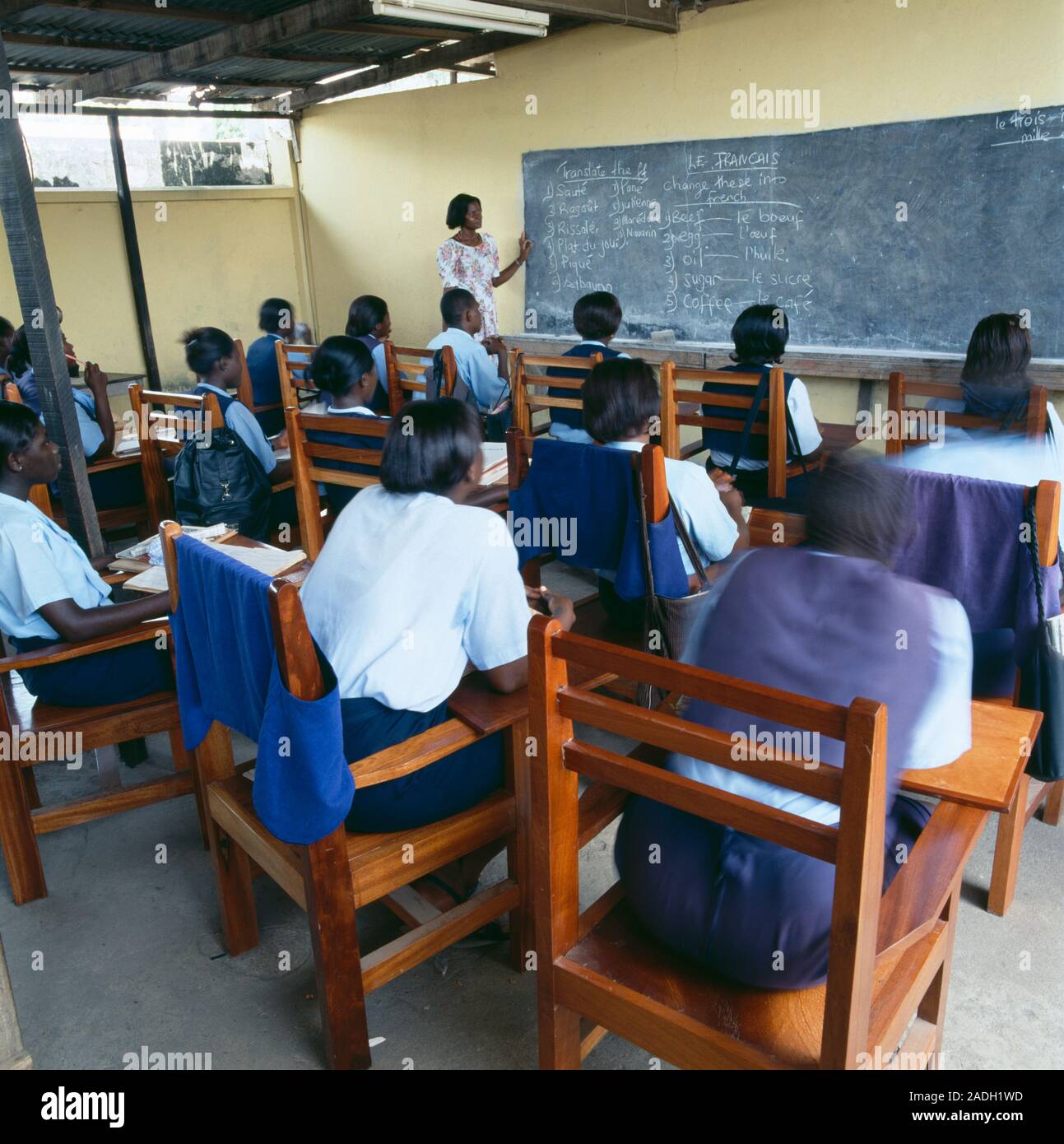French language lesson. Pupils in a school classroom, learning the ...