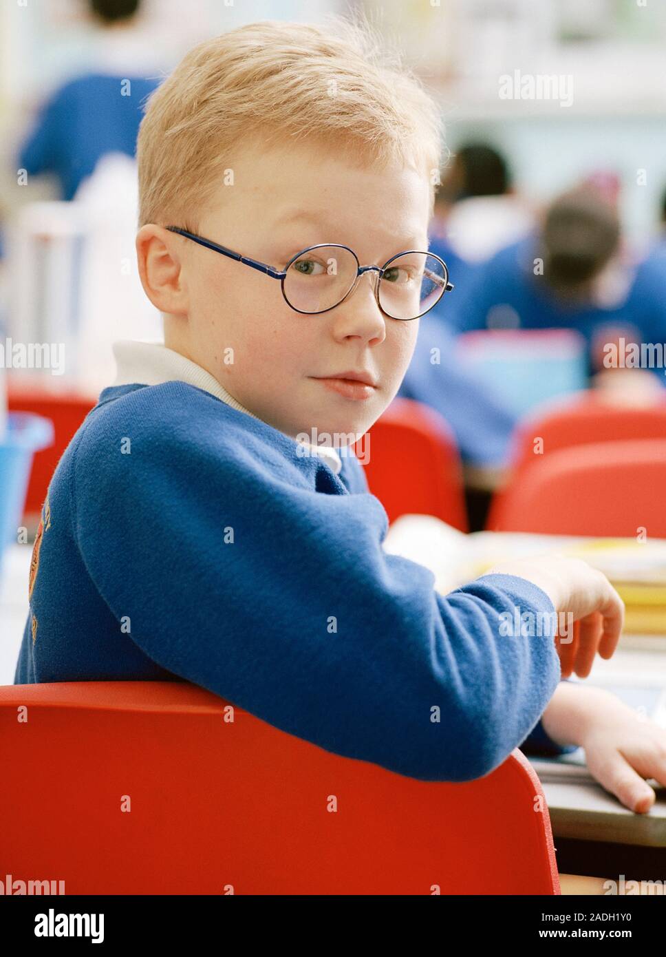 MODEL RELEASED. Schoolboy in a classroom Stock Photo - Alamy