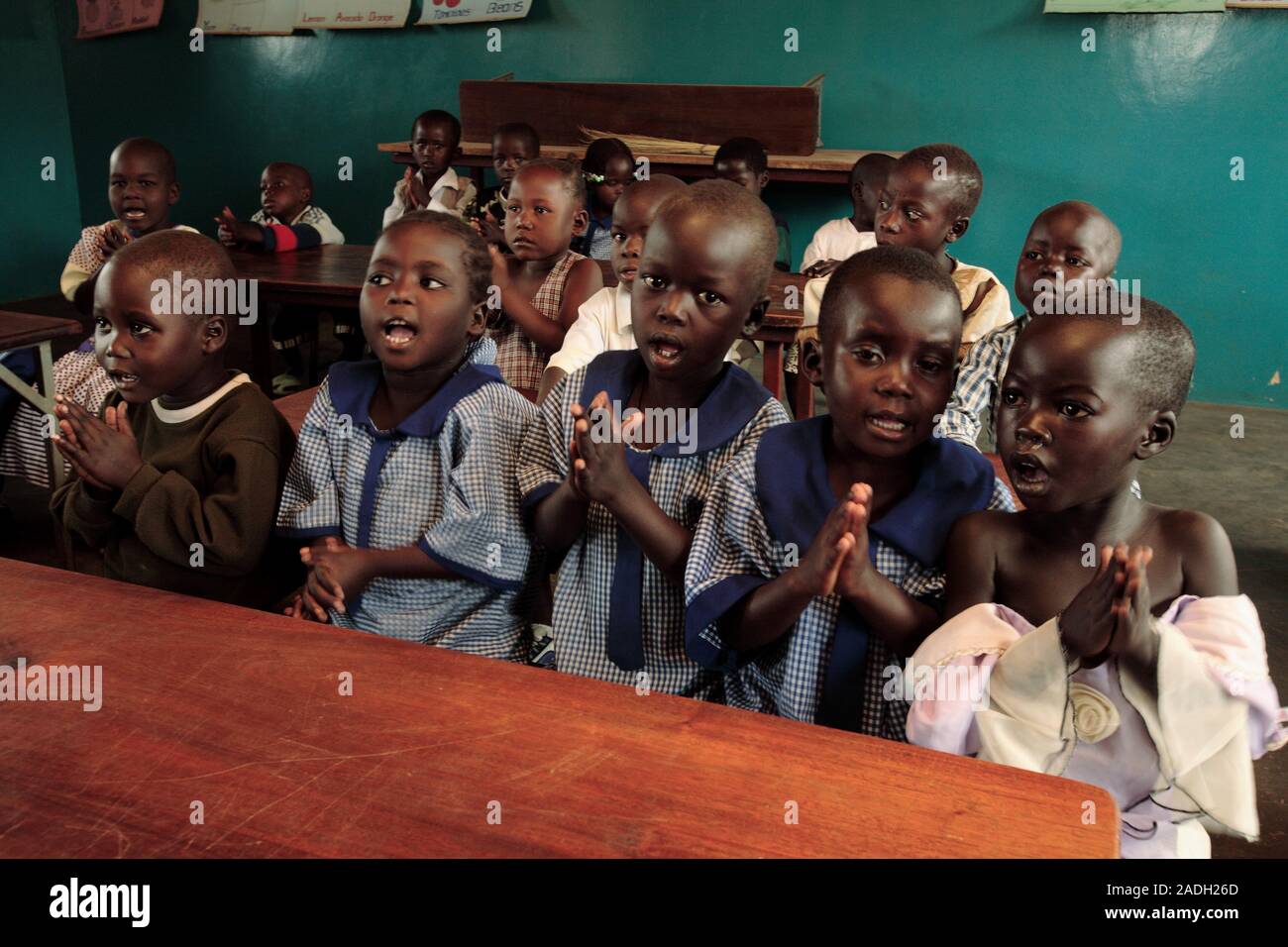 Orphanage school. Pupils reciting a prayer during a lesson ...