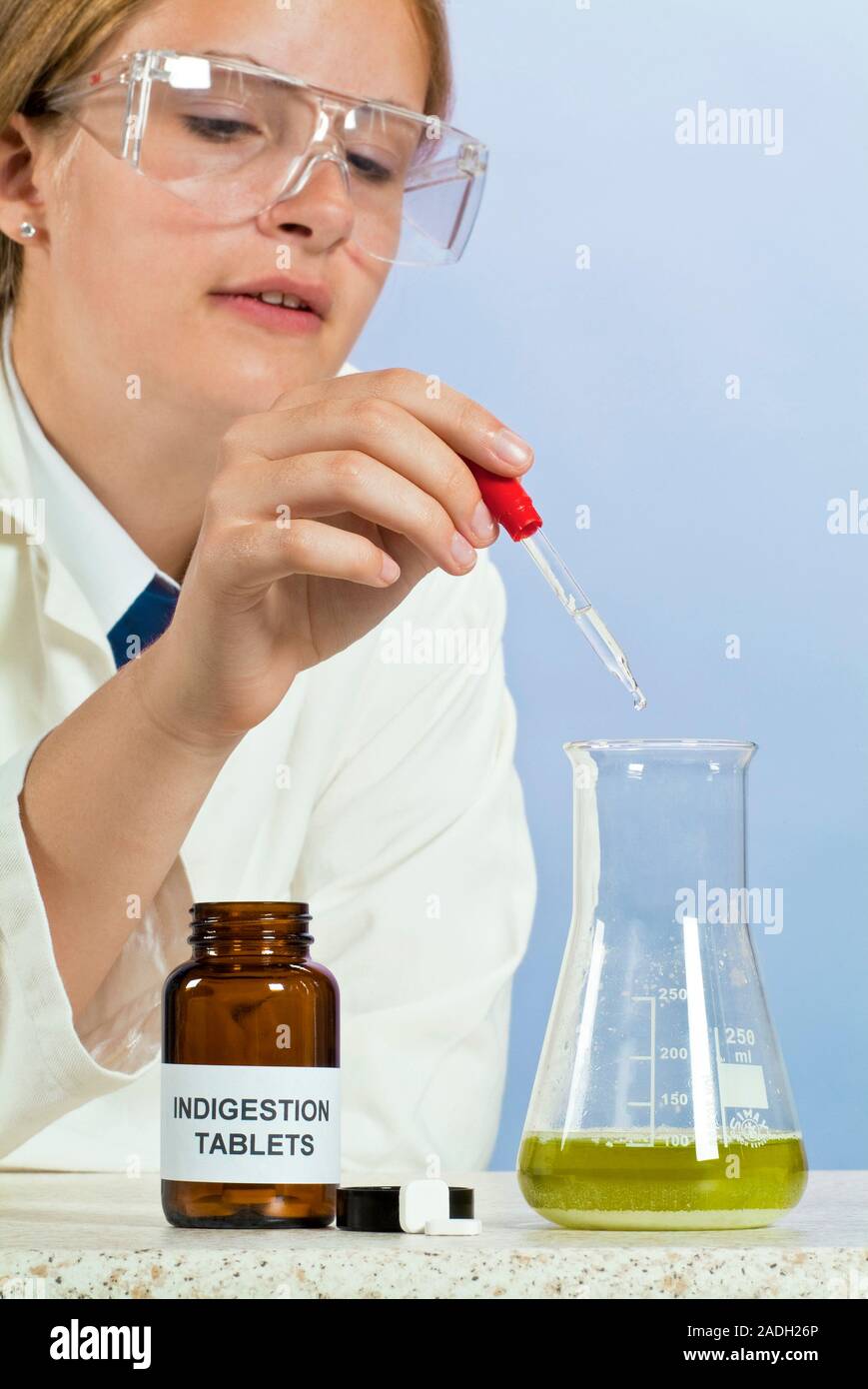 Adding acid to alkaline indigestion tablets. Image 1 of 2. Schoolgirl ...
