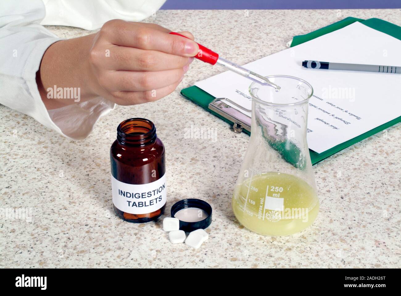 Adding acid to alkaline indigestion tablets. Image 2 of 2. Adding ...