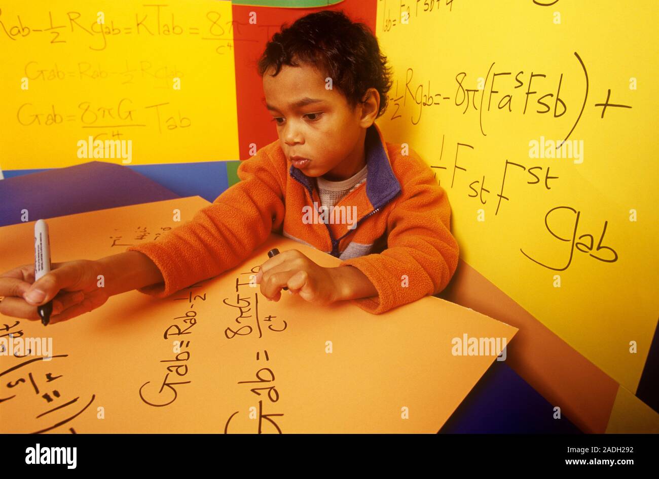 Future physicist. Boy working on theoretical physics equations Stock ...