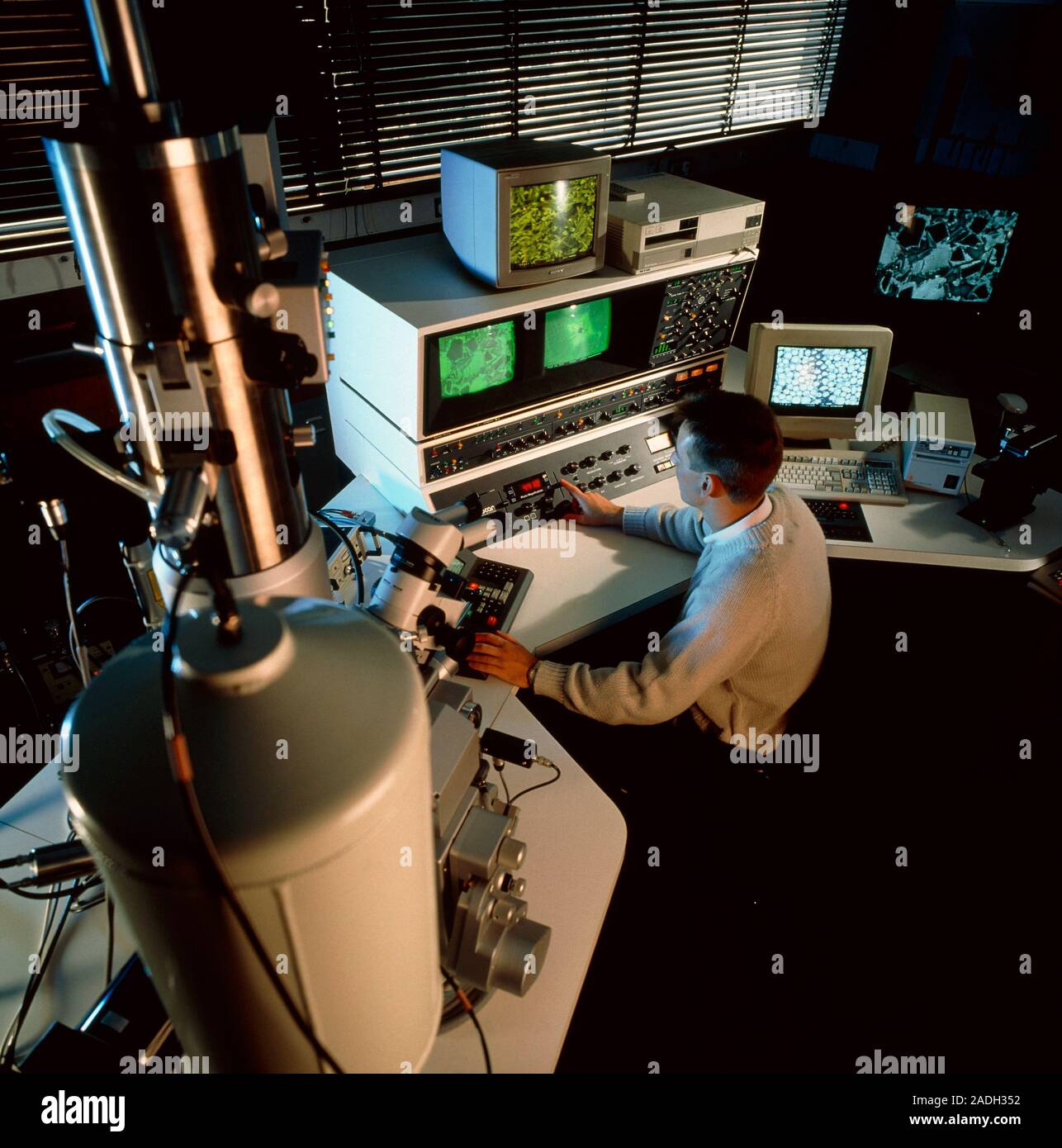 Scanning electron microscope. Researcher using a scanning electron ...