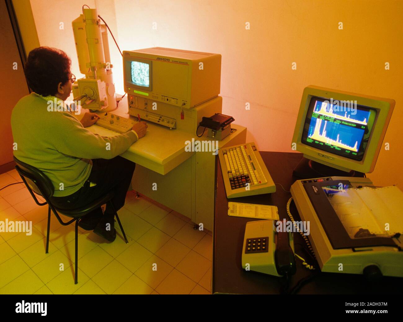 Scanning electron microscope. Researcher looking at a sample using a ...