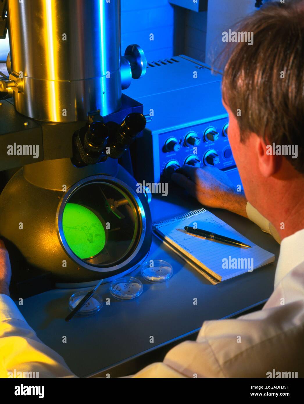 Transmission electron microscope. Researcher uses a transmission ...