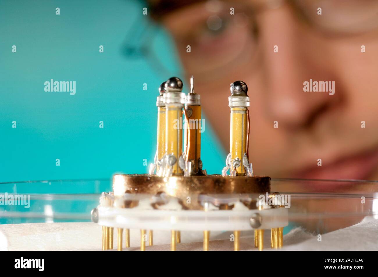 Scanning tunnelling microscope head. Physicist Ali Yazdani looking at ...