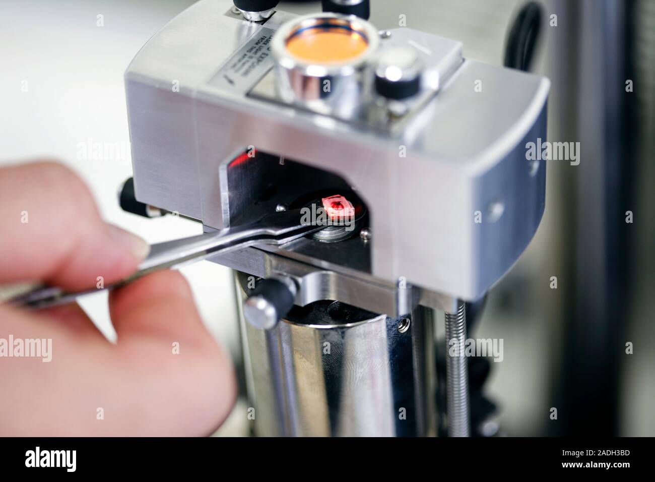 Atomic force microscope (AFM) sample holder being loaded into the AFM ...