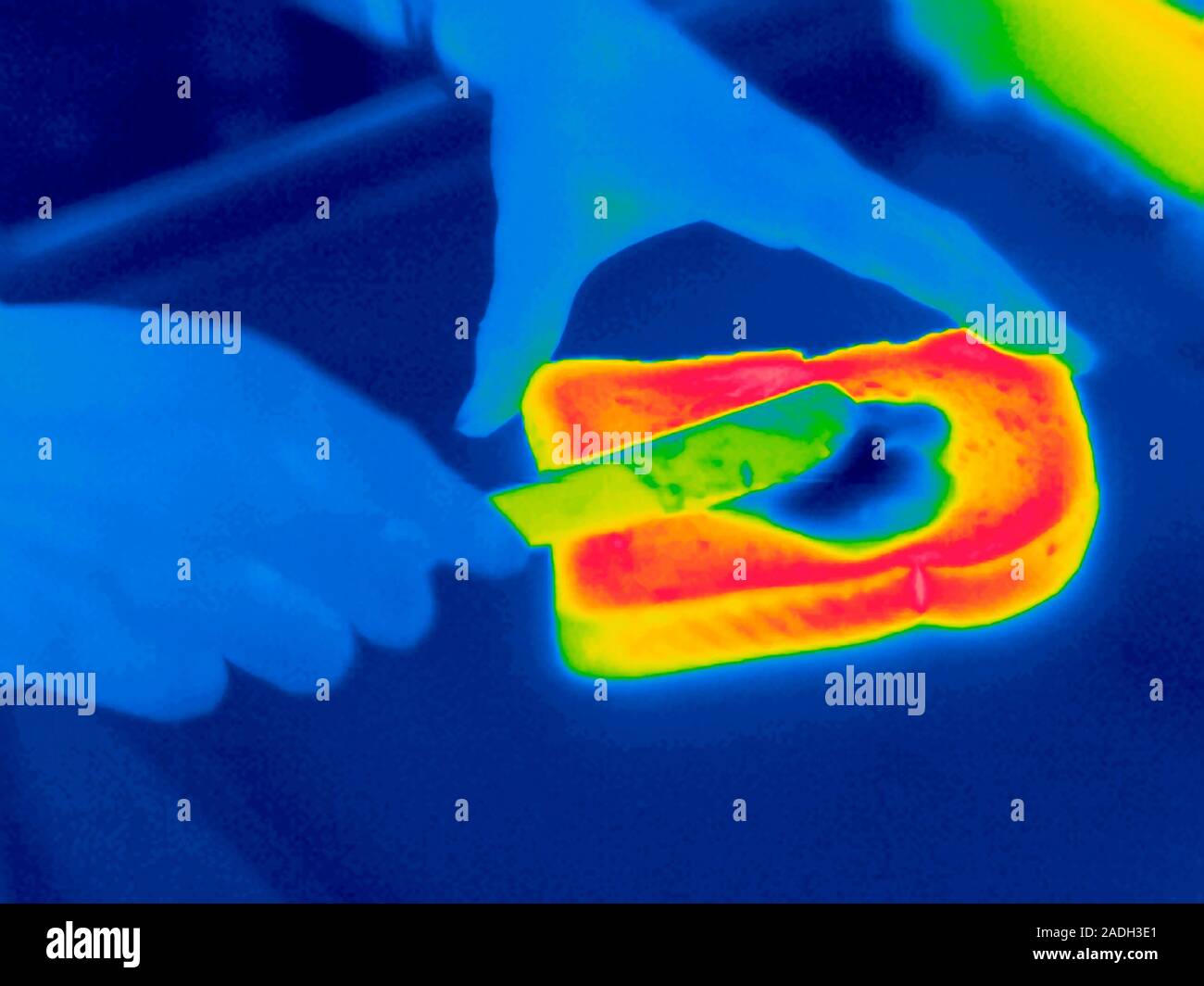 Buttering toast. Thermogram of butter being spread on a slice of toast ...