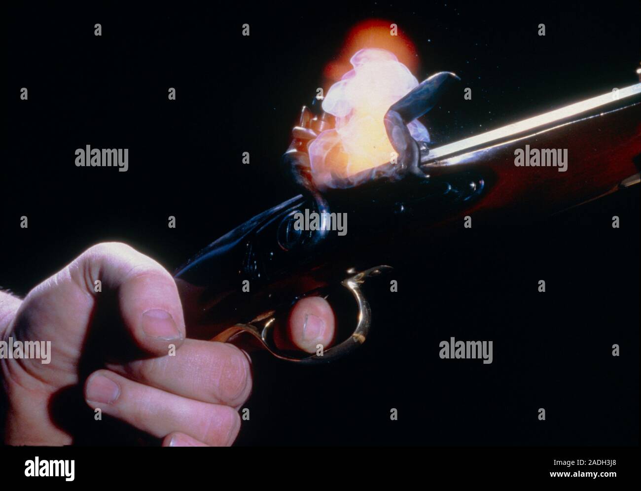 No. 2 in a series of four high-speed photographs of a flintlock pistol ...