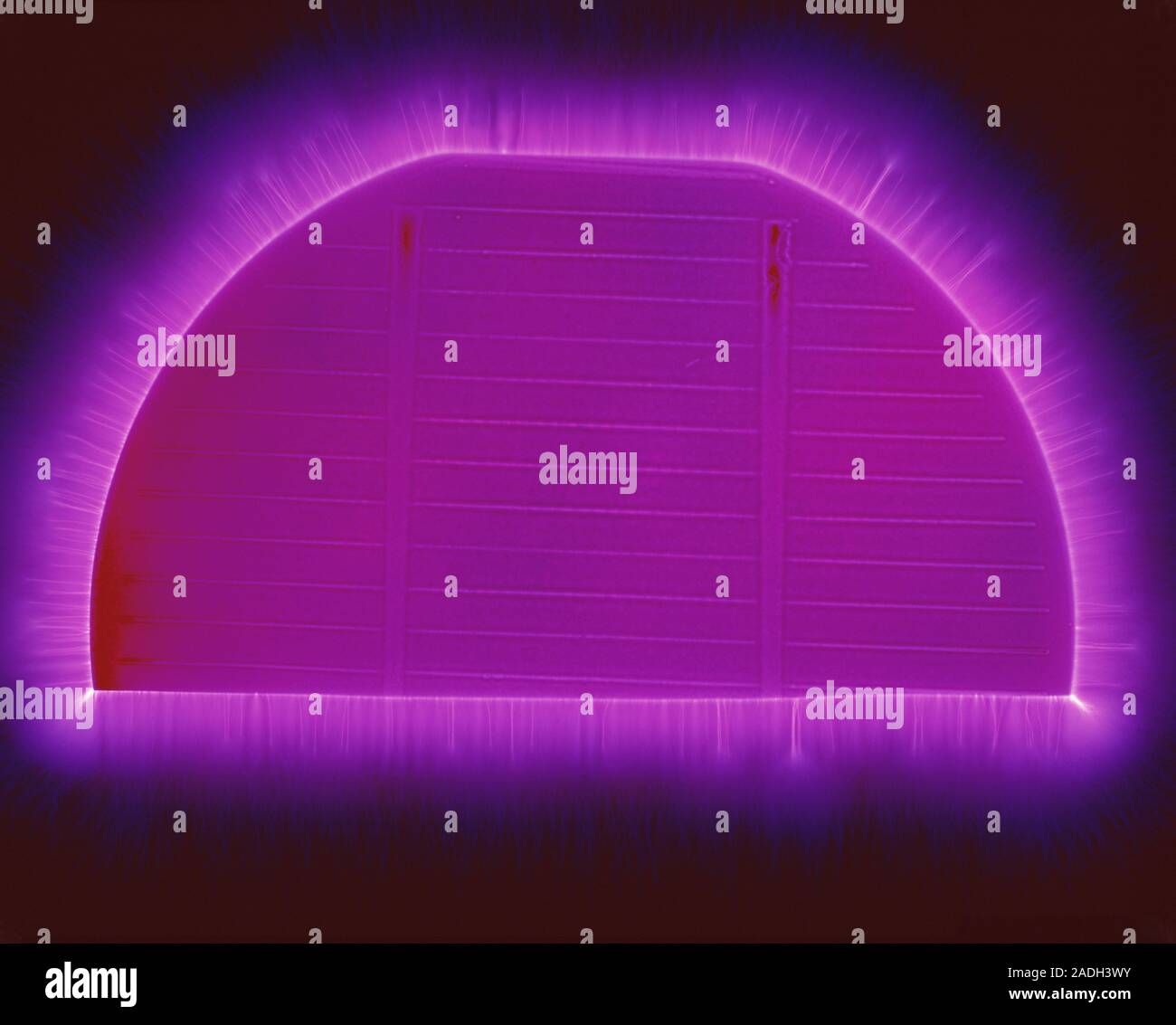 Solar cell, Kirlian image. The luminous discharge seen around the cell ...