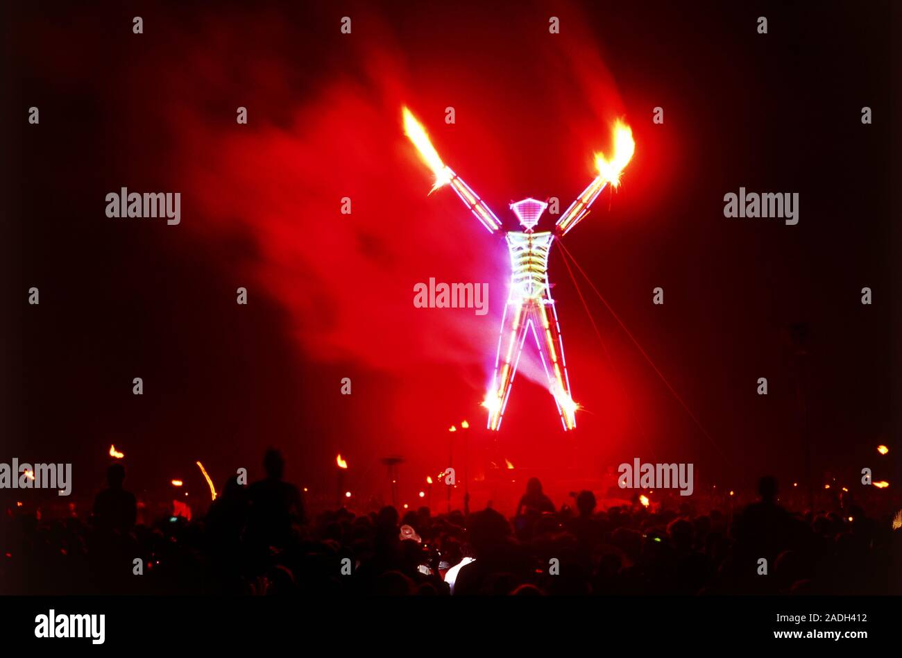Pyrotechnic display. Festival display of a huge human figure of neon ...
