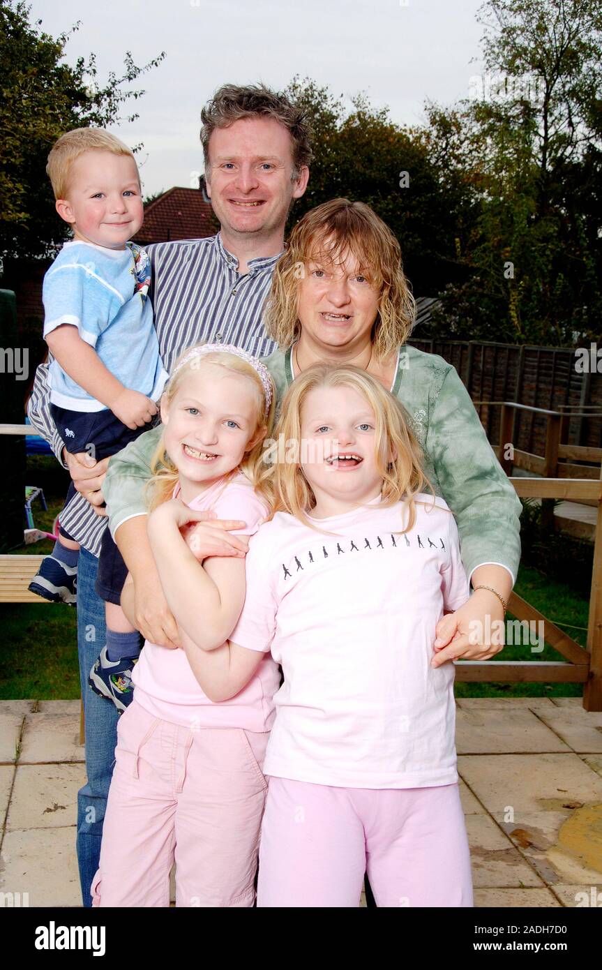 MODEL RELEASED. Angelman syndrome. 10-year-old girl (lower right) with ...
