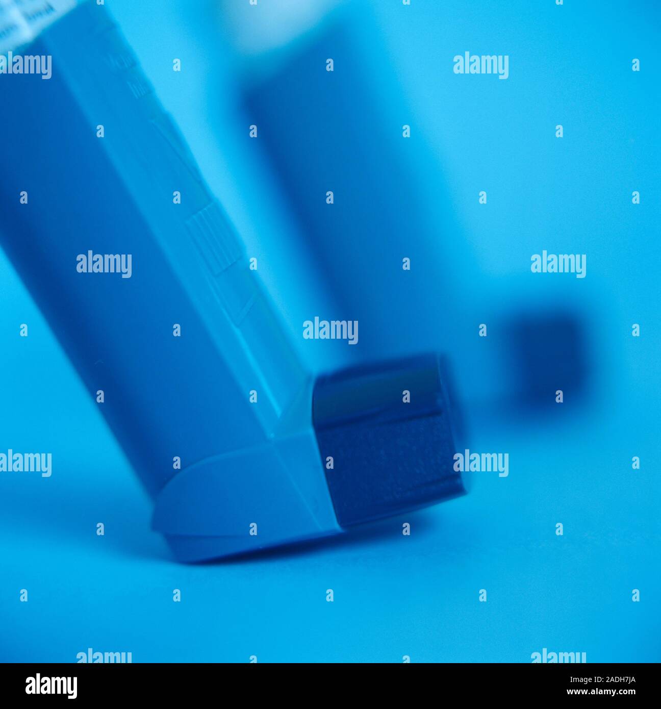 Asthma inhalers. The pump (white) dispenses a bronchodilator drug from ...