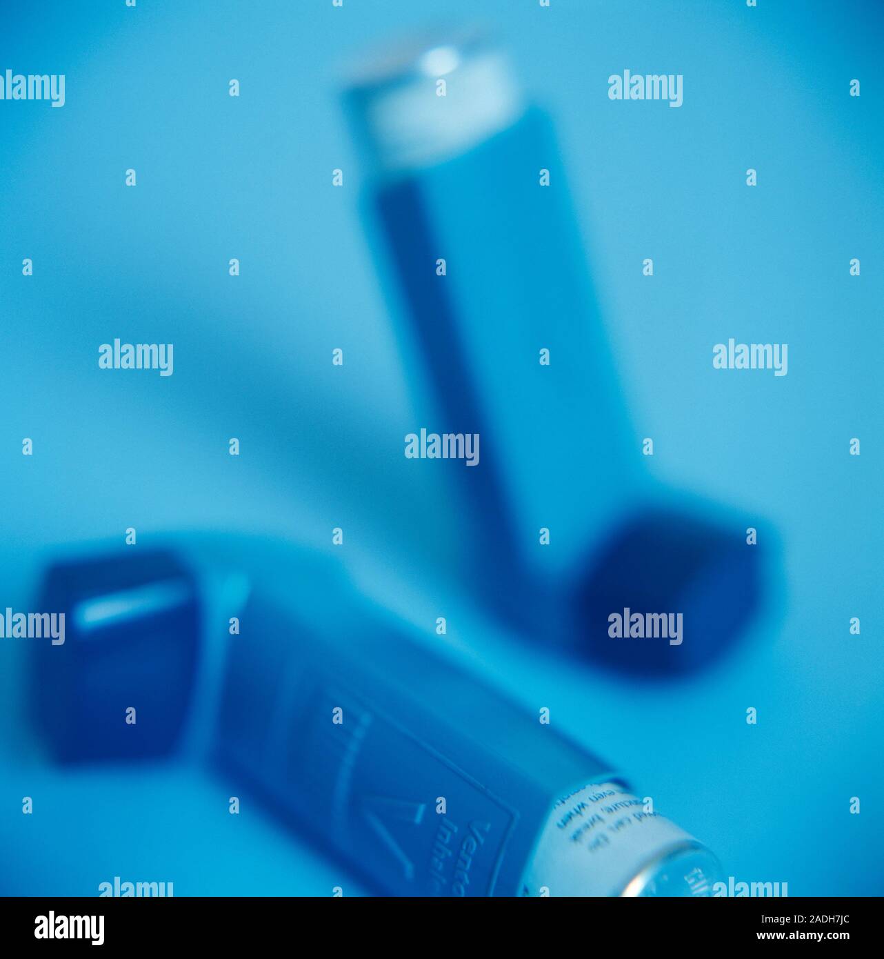 Asthma inhalers. The pump (metal) dispenses a bronchodilator drug from ...