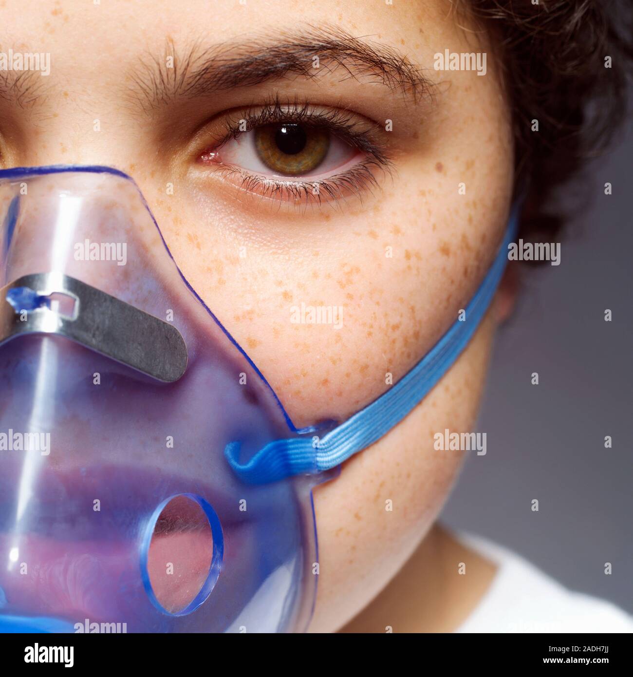 Asthma treatment. Boy using a nebulizer to treat asthma. A nebulizer ...