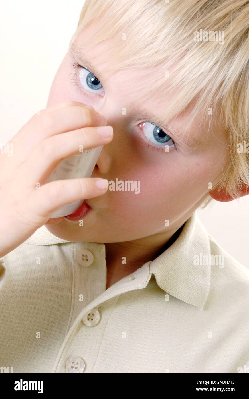 Asthmatic boy using his inhaler Stock Photo - Alamy