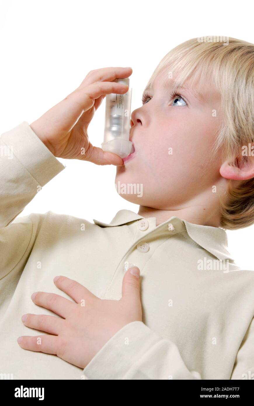 Asthmatic boy using his inhaler Stock Photo - Alamy