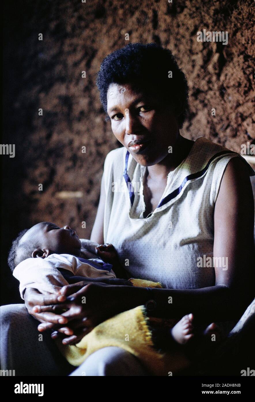 HIV+ mother with her child. Woman infected with HIV (human ...