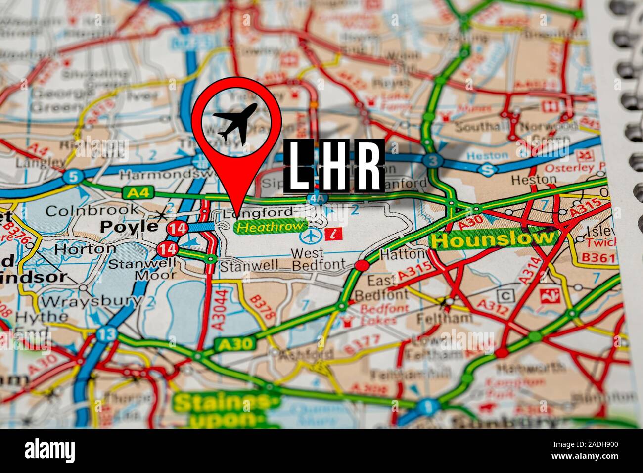 Red Pin on Paper Map Showing Position of Heathrow Airport Stock Photo ...
