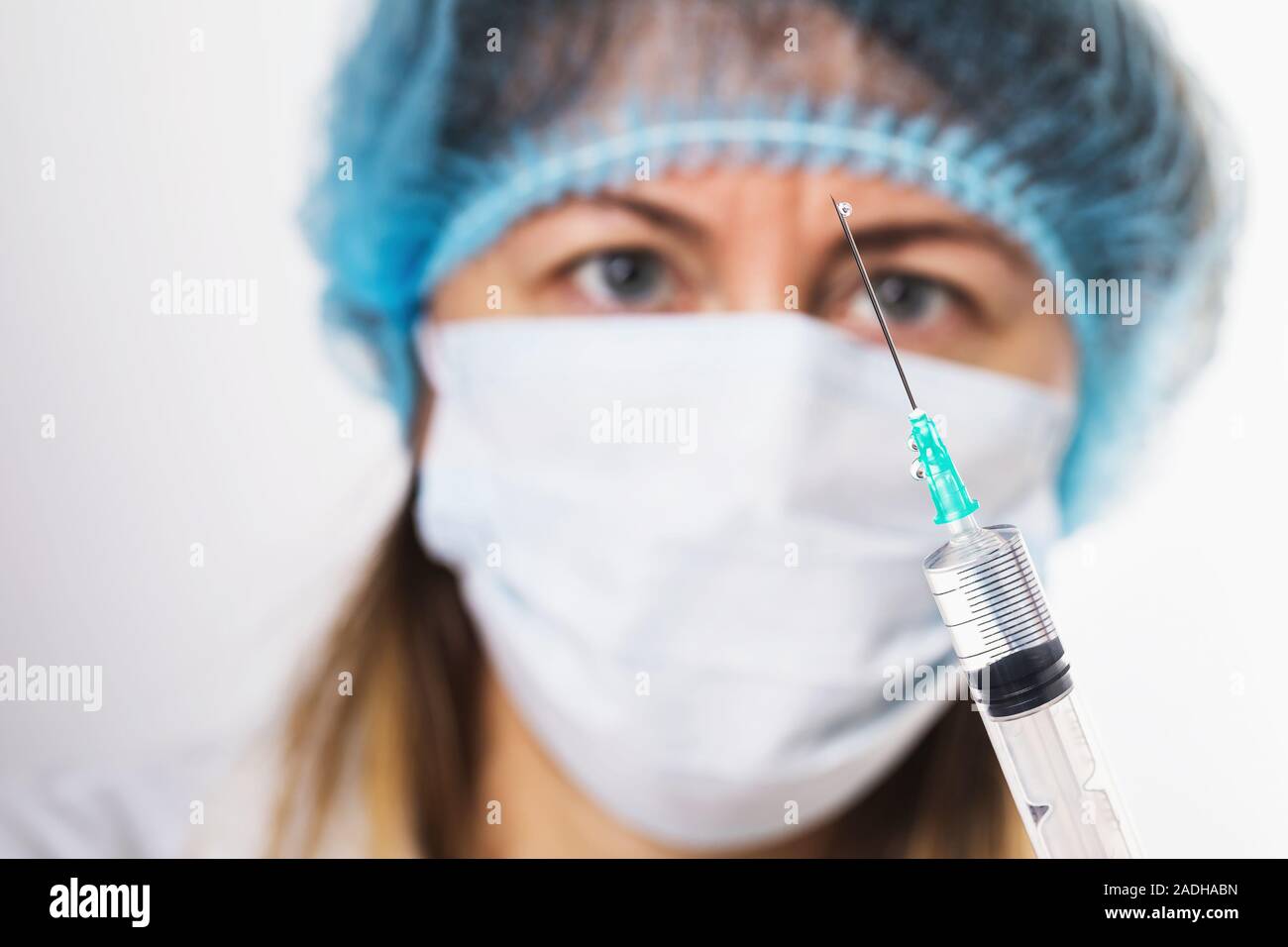 The doctor checks the syringe before injection, close-up Stock Photo ...
