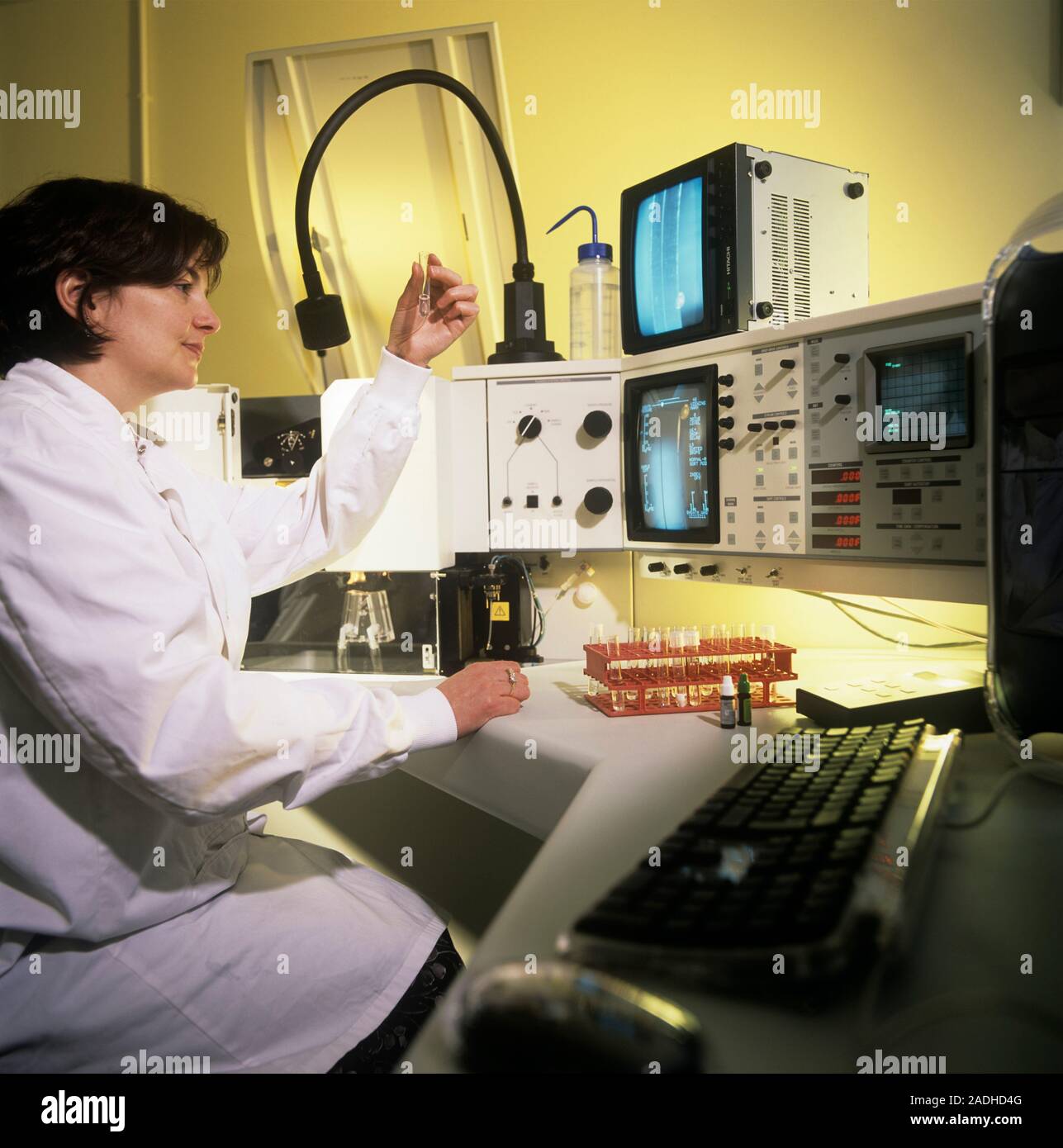 MODEL RELEASED. Cancer research. Researcher studying the progression of ...