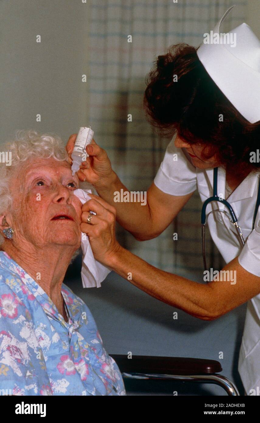 Nurse putting eye drops in an elderly patient's eye Stock Photo - Alamy