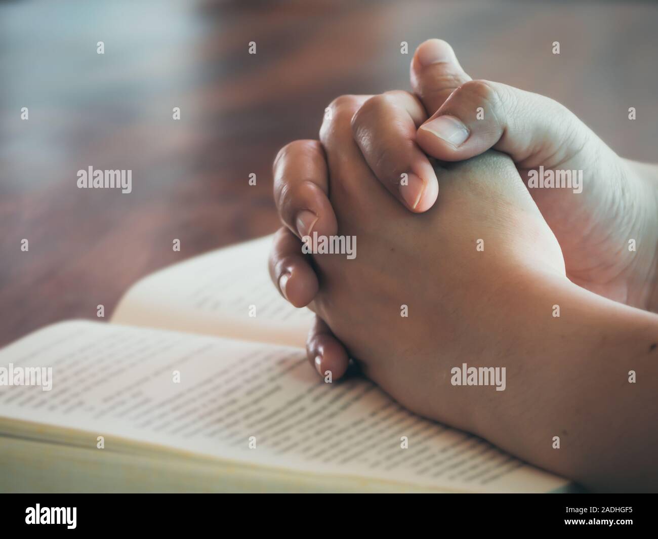 Hand of woman praying for christian religion with blurred background ...