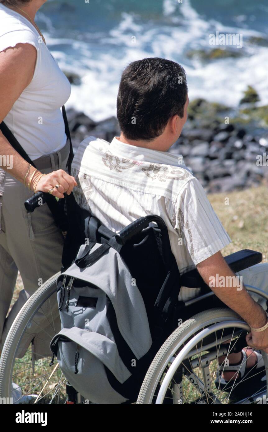 MODEL RELEASED. Kugelberg-Welander disease. Man in a wheelchair with ...