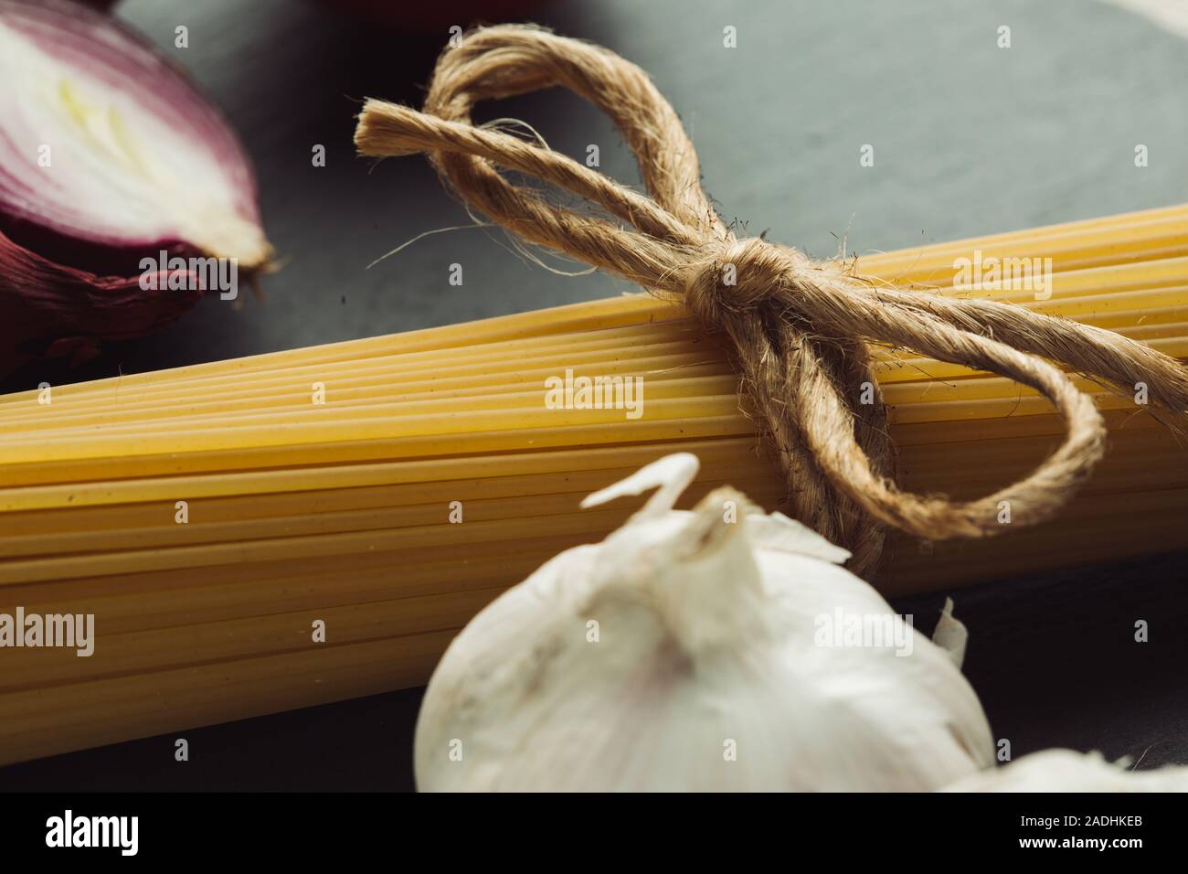 Natural string rope on Italian uncooked pasta Stock Photo - Alamy