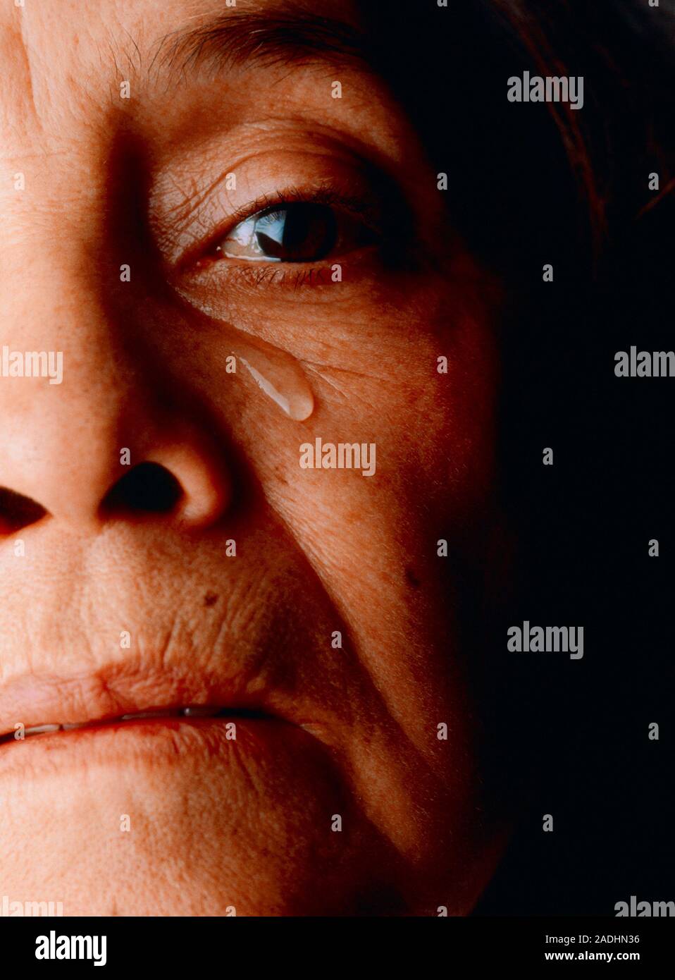 MODEL RELEASED. Depression. Face of an elderly woman looking depressed ...