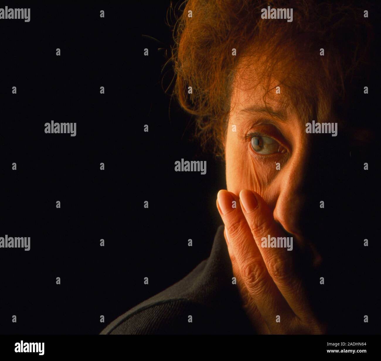 Depression. Depressed and upset woman holding her hand over her mouth ...