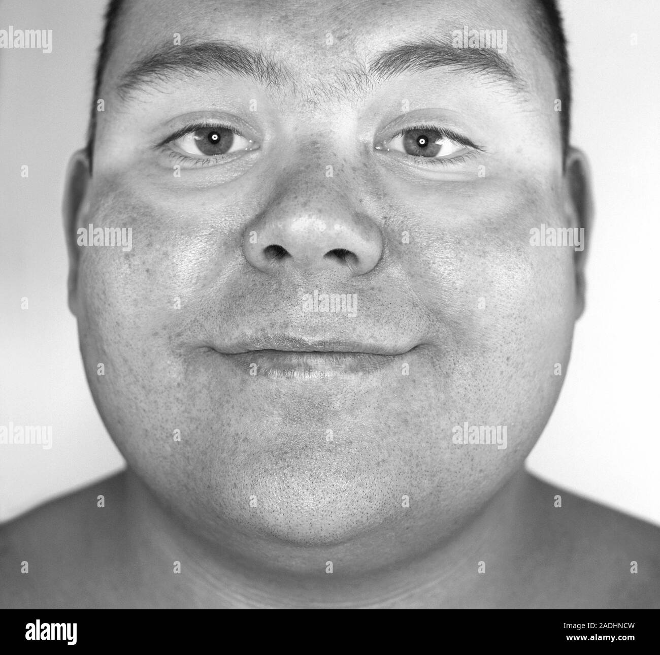 Smiling face of an overweight man Stock Photo - Alamy