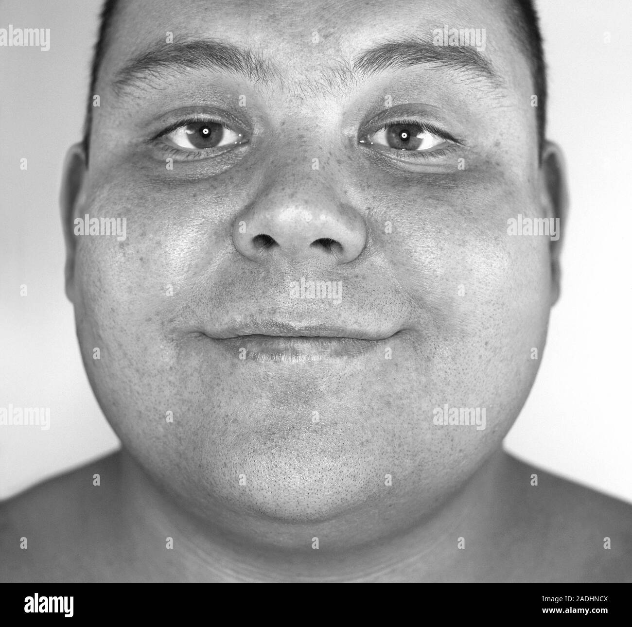 Smiling face of an overweight man Stock Photo - Alamy