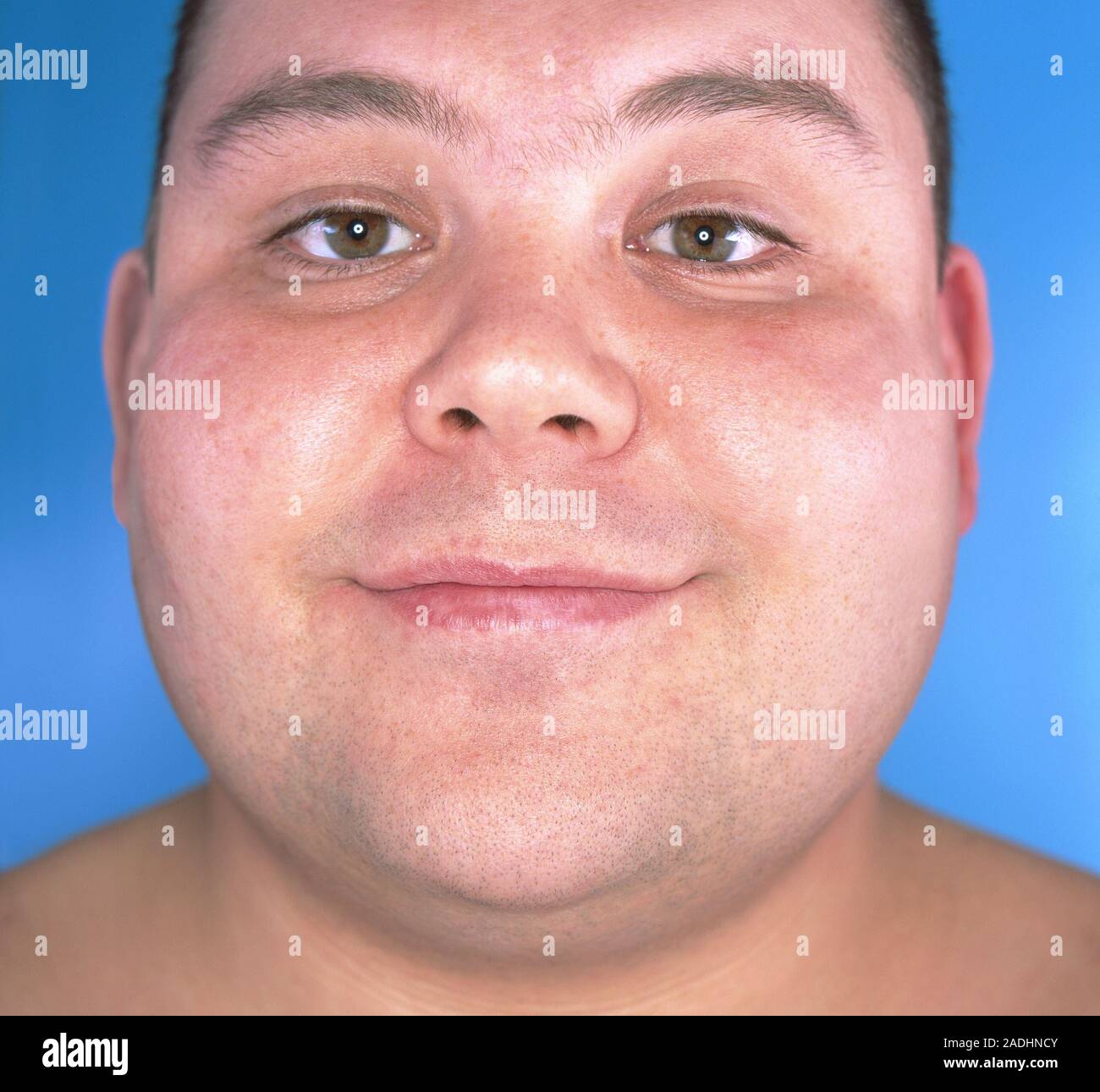 Smiling face of an overweight man Stock Photo - Alamy