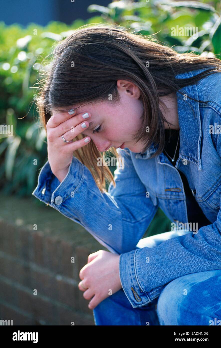Depressed 18-year-old woman Stock Photo - Alamy