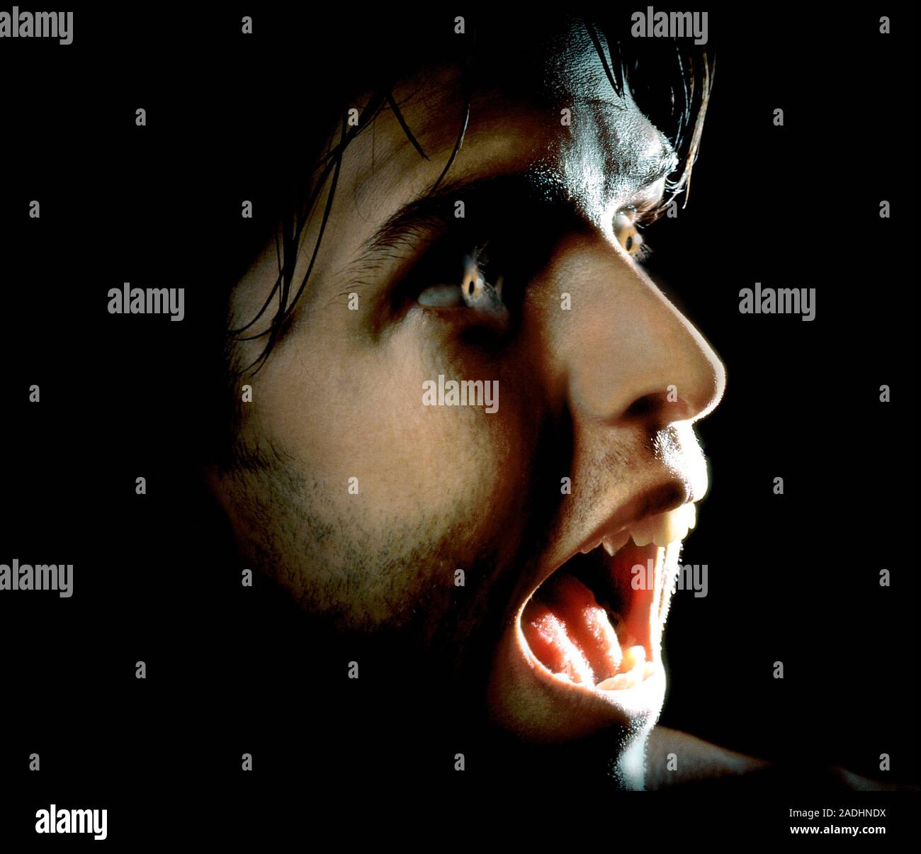 Madness. Conceptual image of a man crying out. This could represent a ...