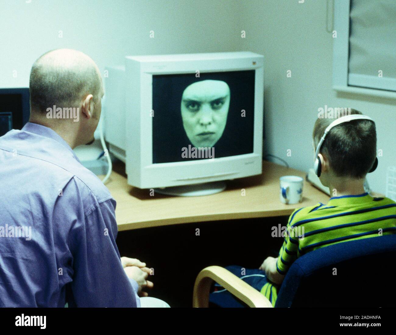 Autism test. Researcher assessing the social- emotional processing ...