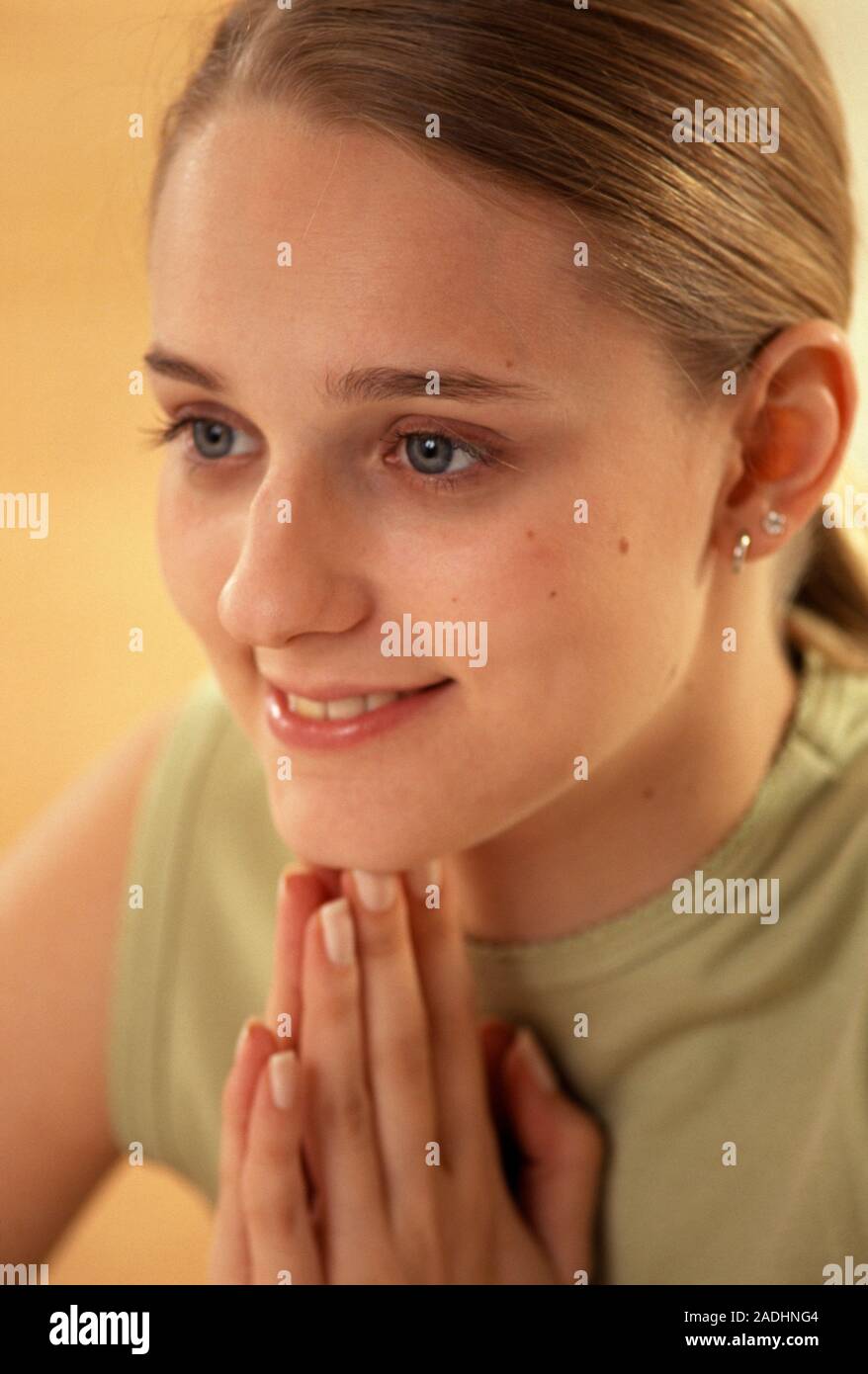 Happy woman. Face of a smiling young woman with a thoughtful, hopeful ...