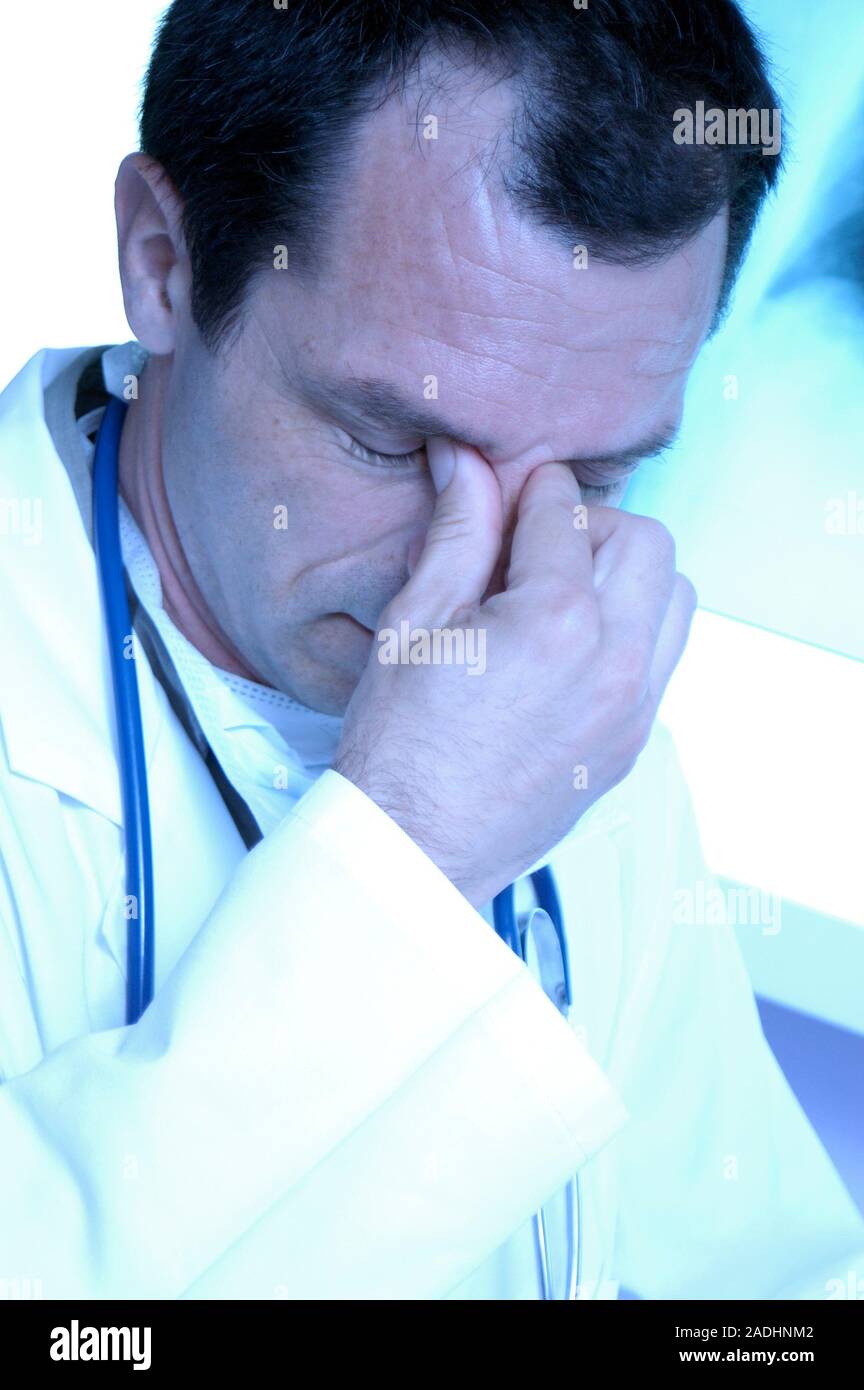 MODEL RELEASED. Stressed doctor Stock Photo - Alamy