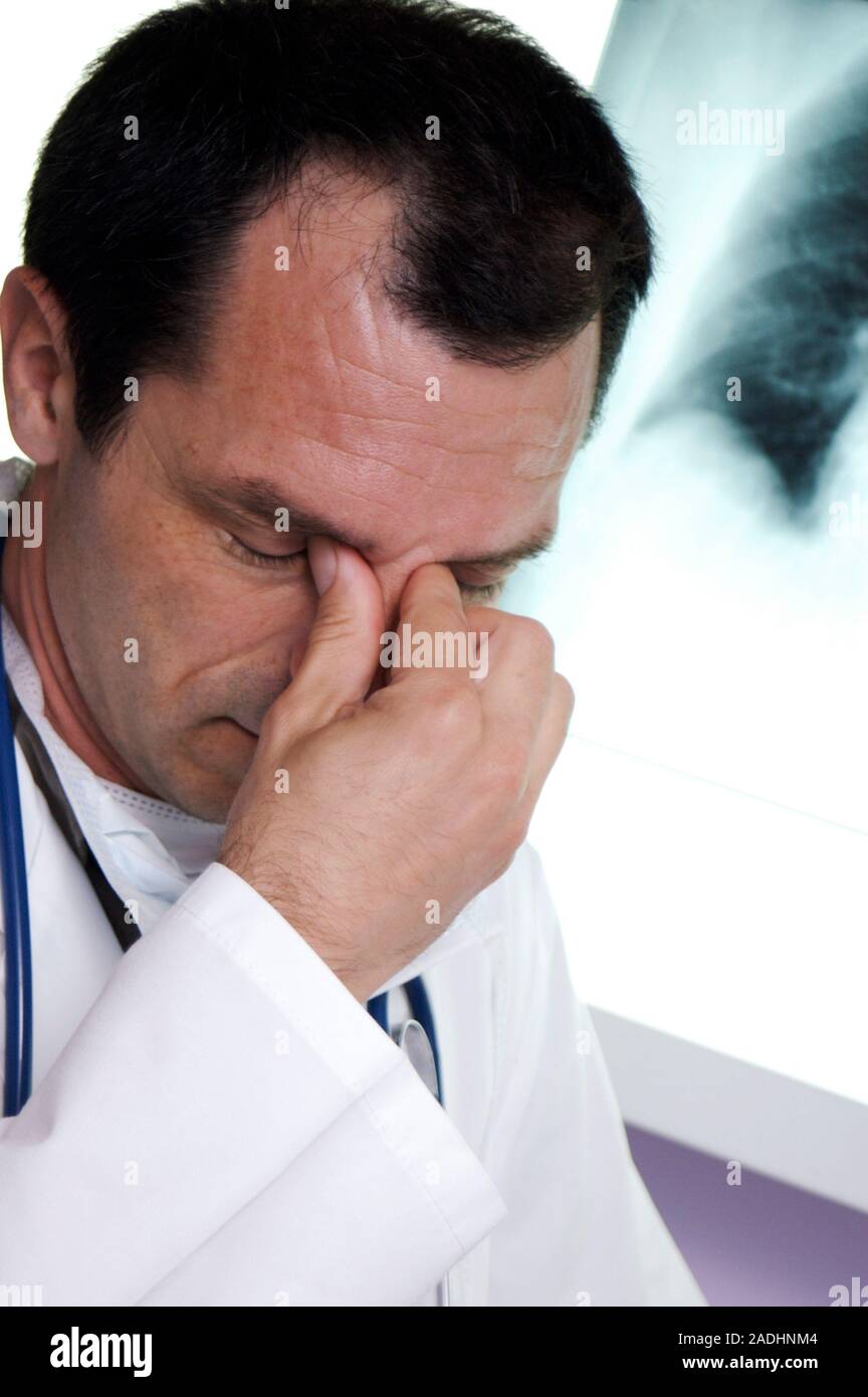 MODEL RELEASED. Stressed doctor Stock Photo - Alamy