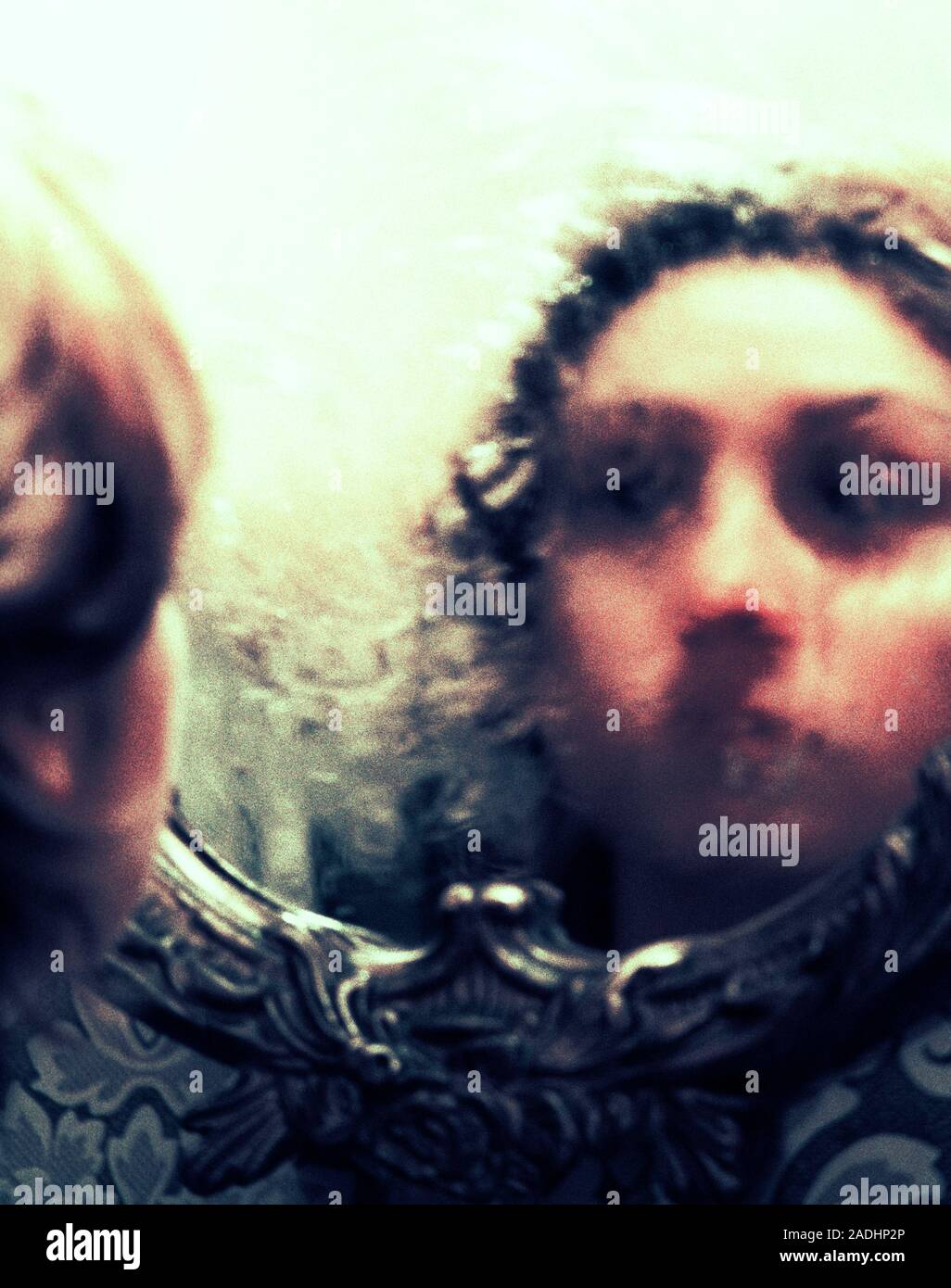 Agoraphobia, conceptual image. Reflection of a woman looking into a ...